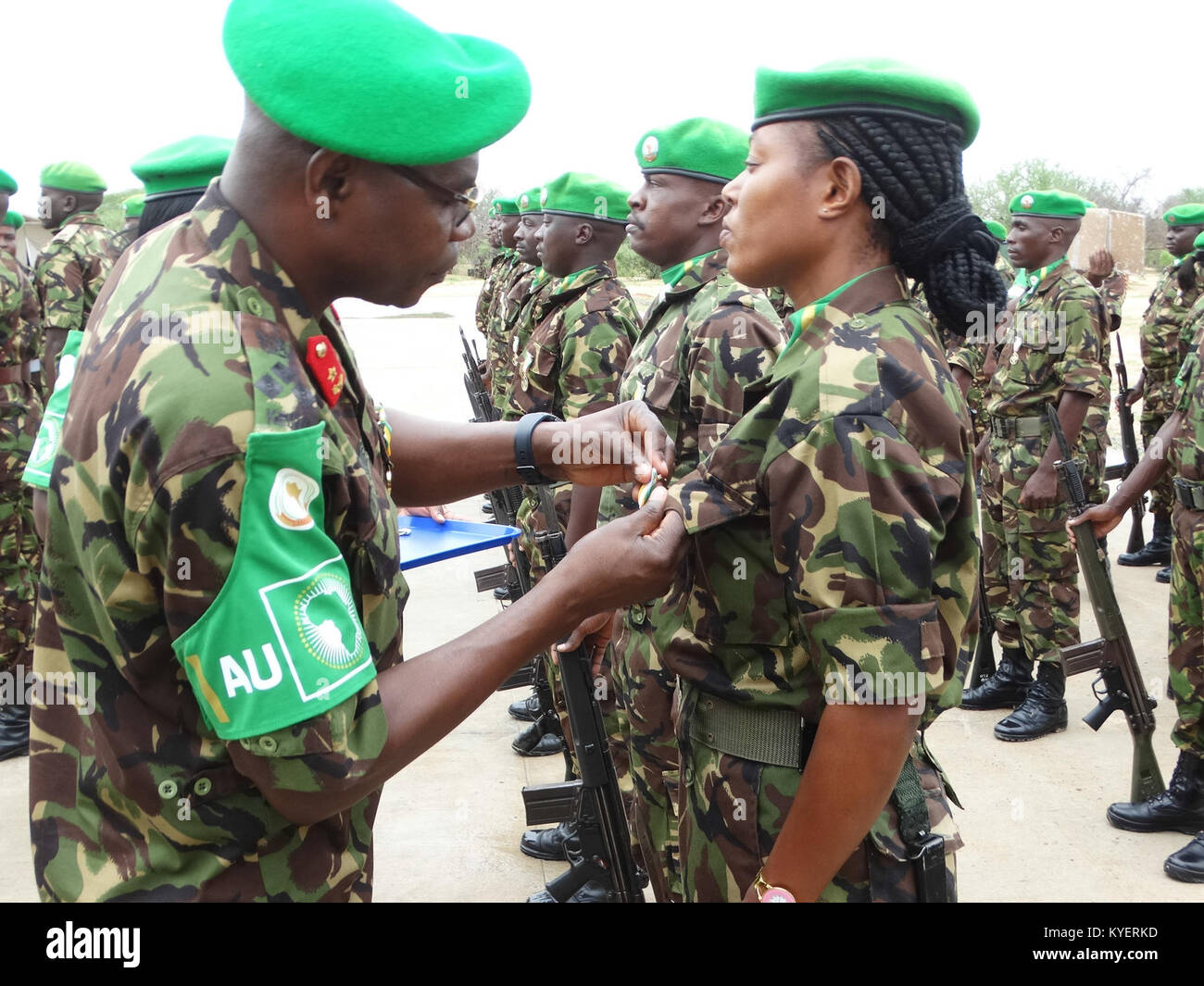 Corporal Martha Maroa, receives her recognition medal from AMISOM ...