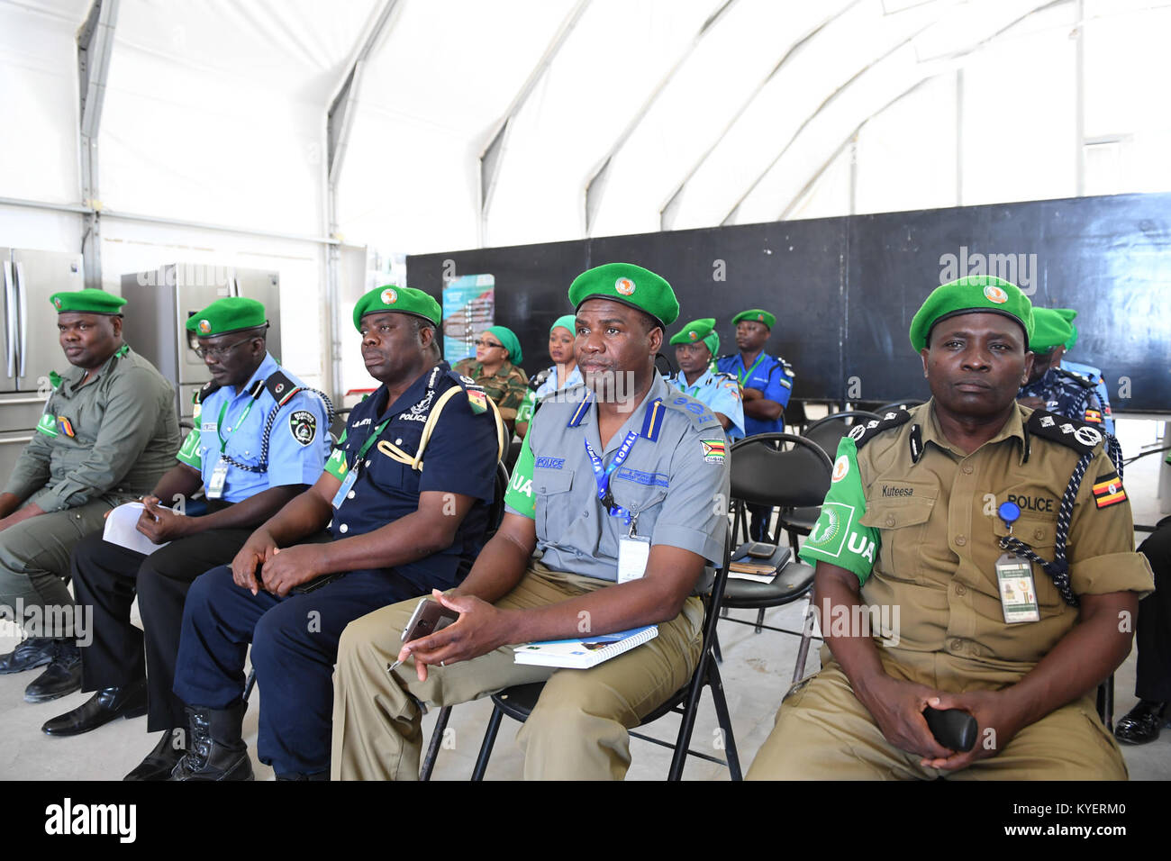 Senior police officers from AMISOM at a farewell ceremony for Ugandan ...
