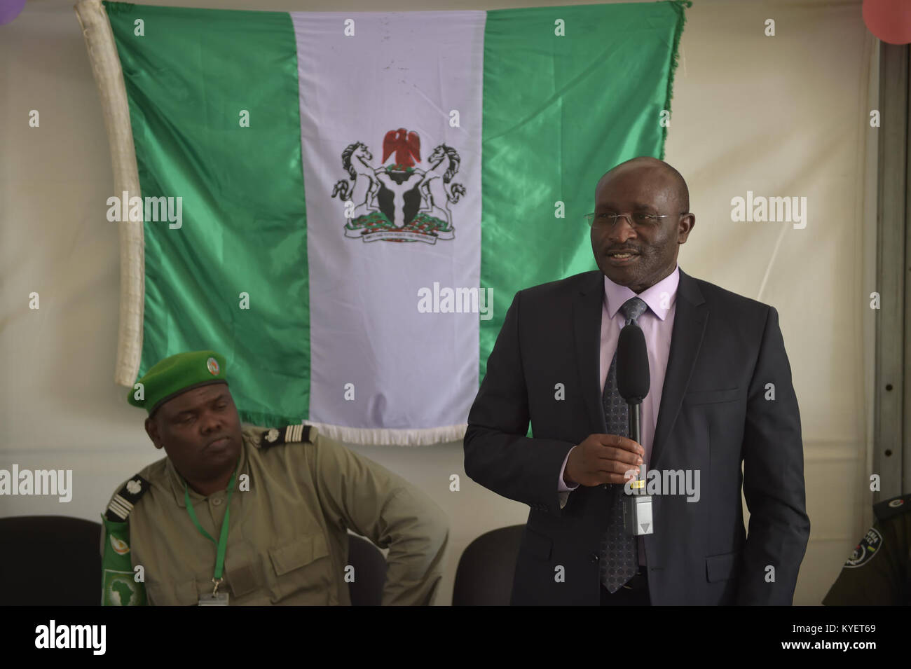 Simon Mulongo, from AMISOM's DSRCC, speaks during a medal ceremony to ...