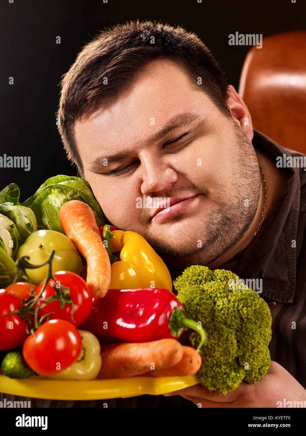 Diet fat man eating healthy food . Healthy breakfast with vegetables ...