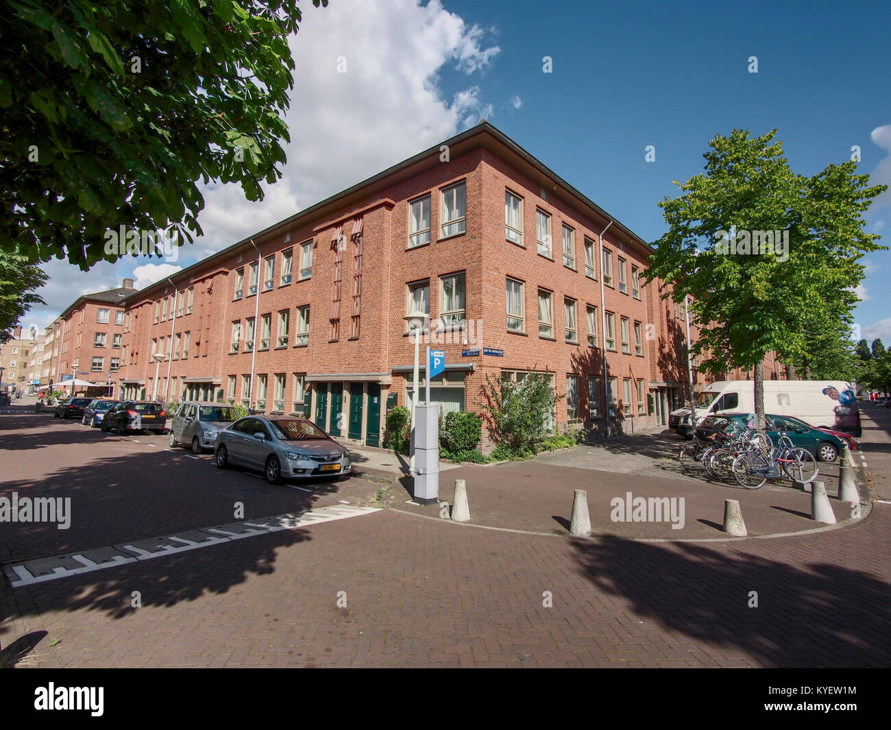 The photo shows an intersection in Amsterdam, specifically the corner ...