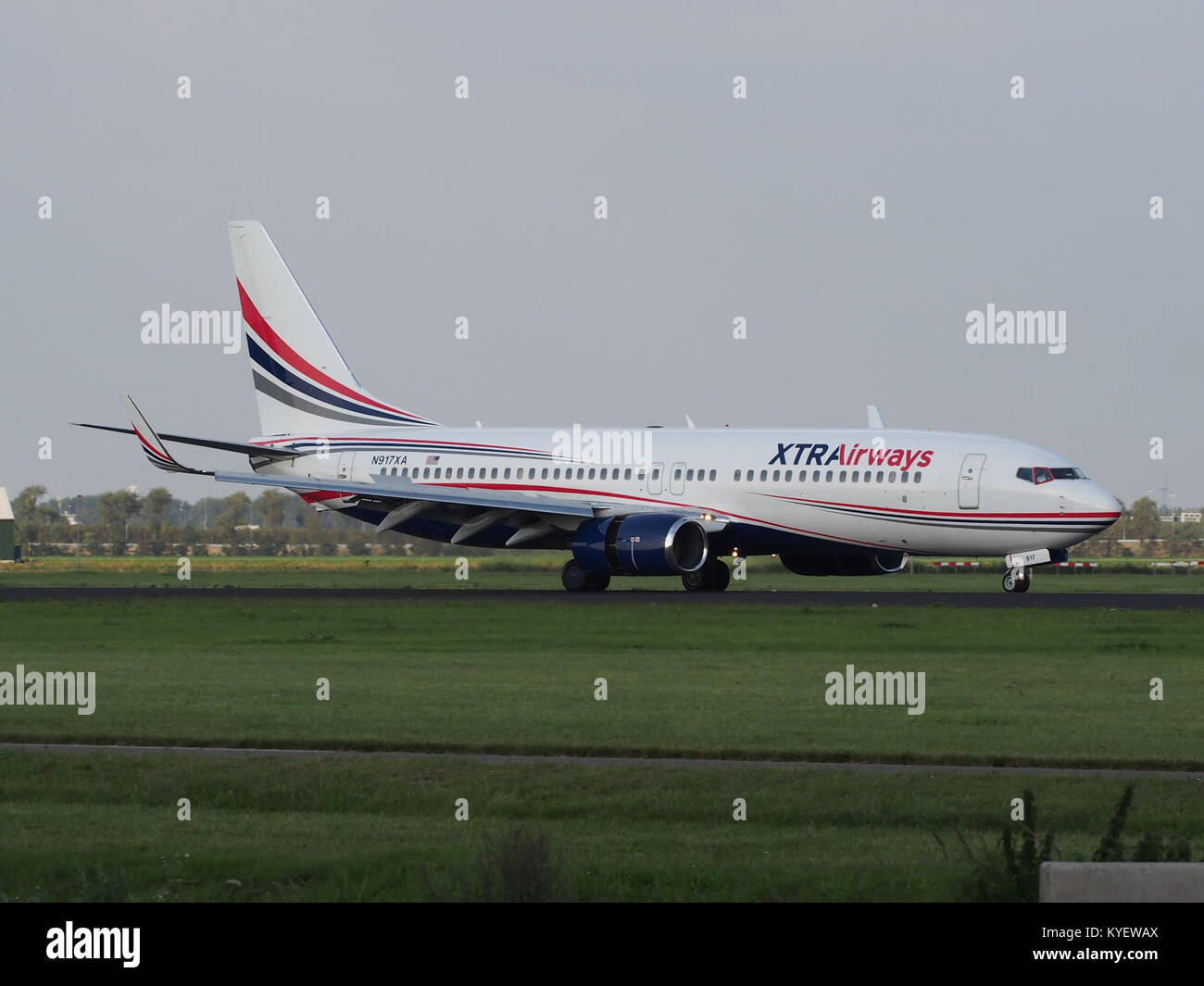 A photograph of Xtra Airways Boeing 737-86J, registration N917XA, landing on runway 18R at ...