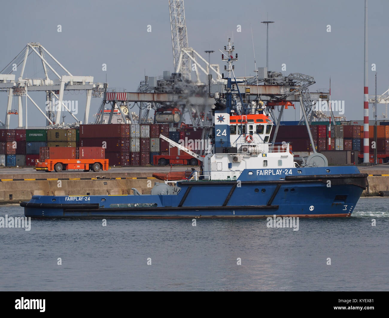 A photograph of the tugboat Fairplay-24 in the Rotterdam port area ...