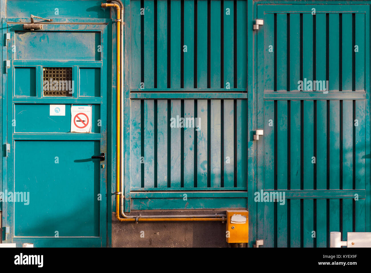 Blue and Yellow factory exhaust door in Dubai Stock Photo - Alamy