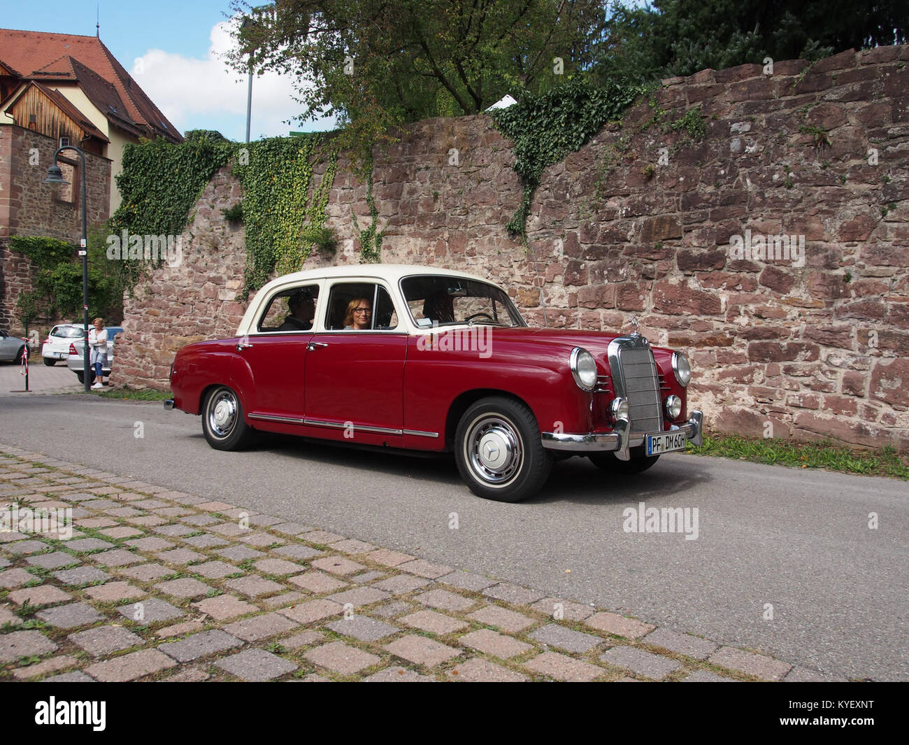 A photograph of a red and white Mercedes car during the 2017 Rund ums ...