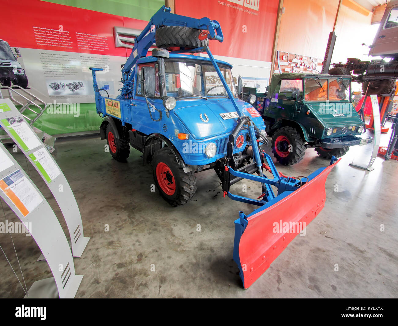 A photo of an Unimog with a snow plow attachment, displayed at the ...