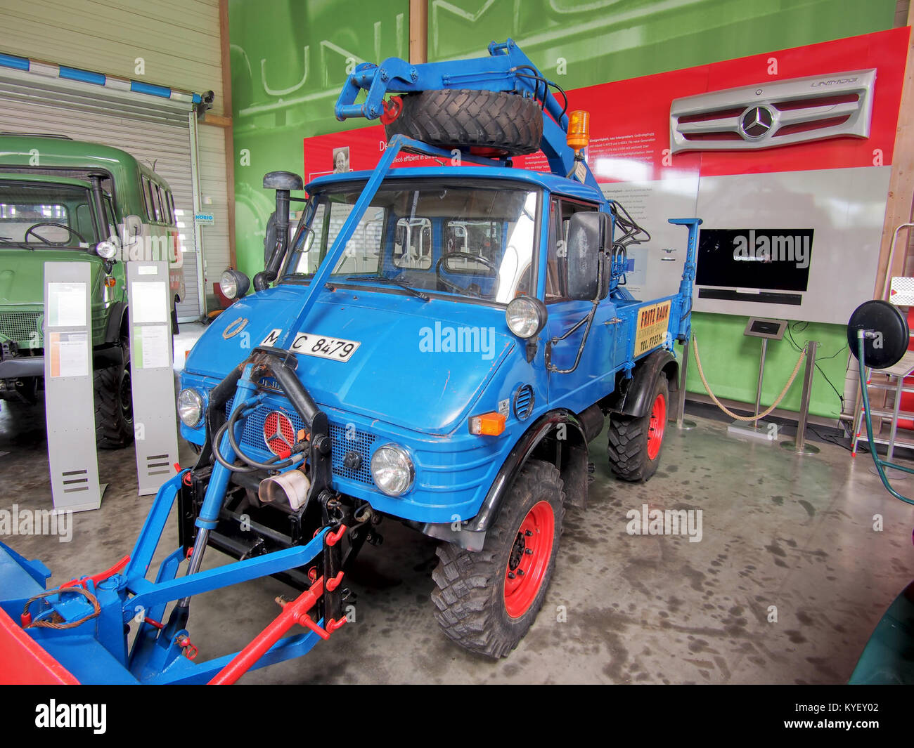 A Unimog vehicle equipped with a snowplow, photographed at the Unimog ...