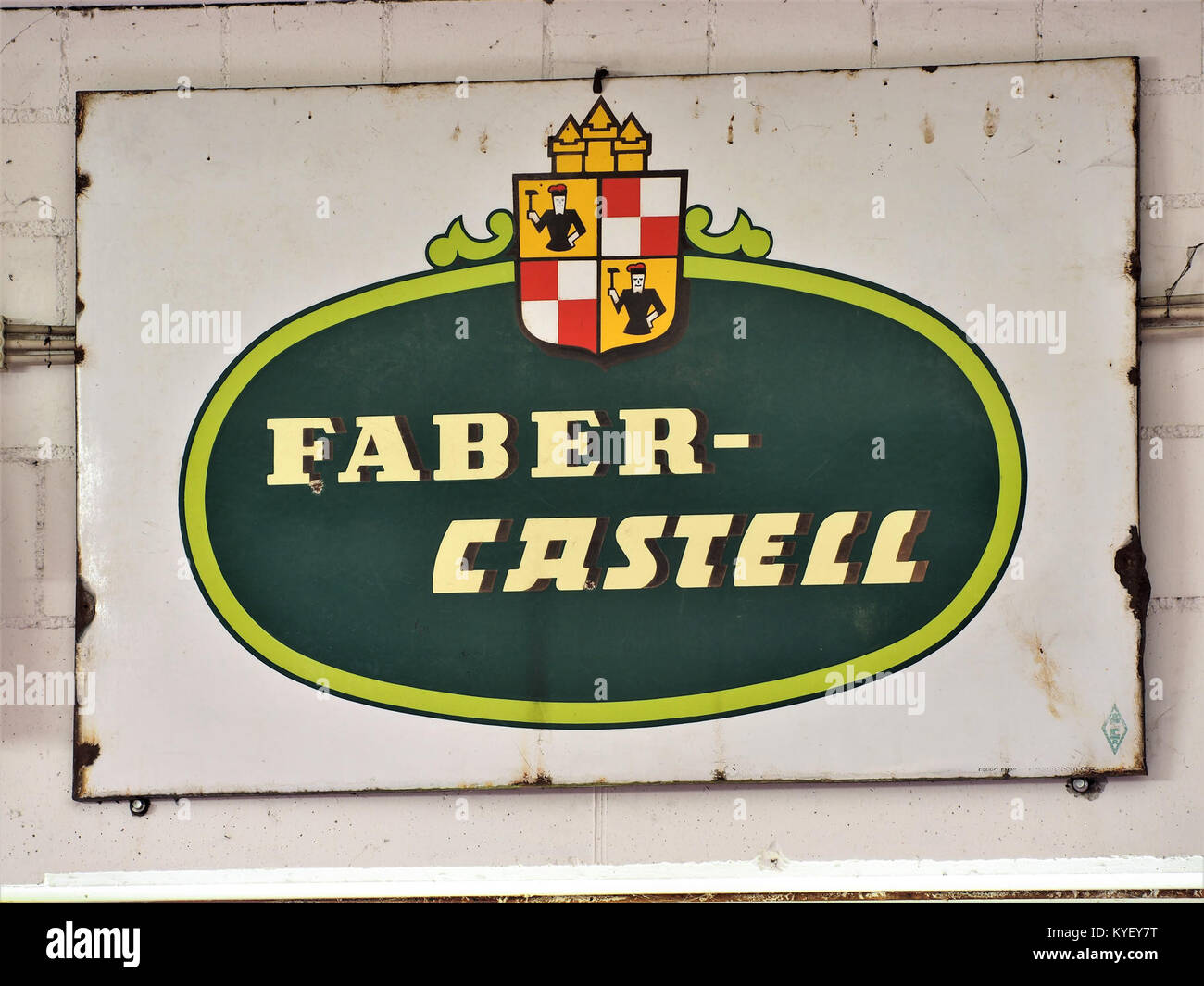 This image features a Faber-Castell enamel advertisement sign ...