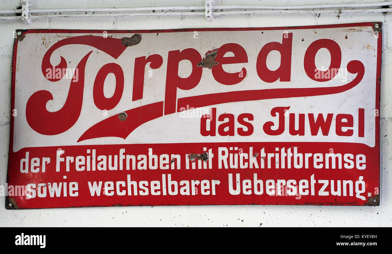 A vintage enamel advertising sign for 'Torpedo das Juwel' displayed at ...