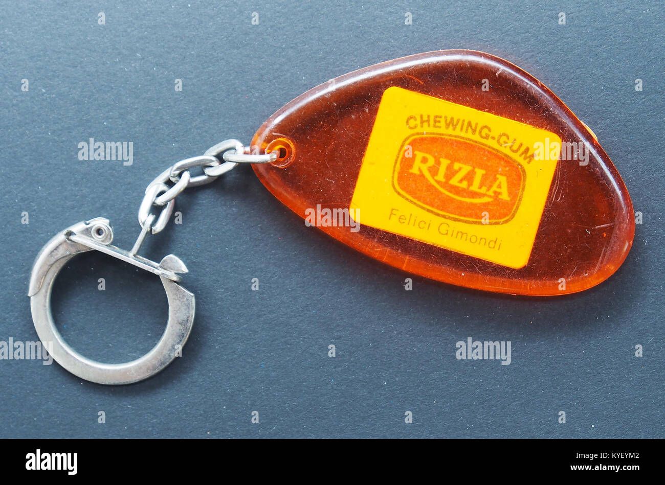 A vintage keychain featuring the Rizla logo. The keychain is part of a ...