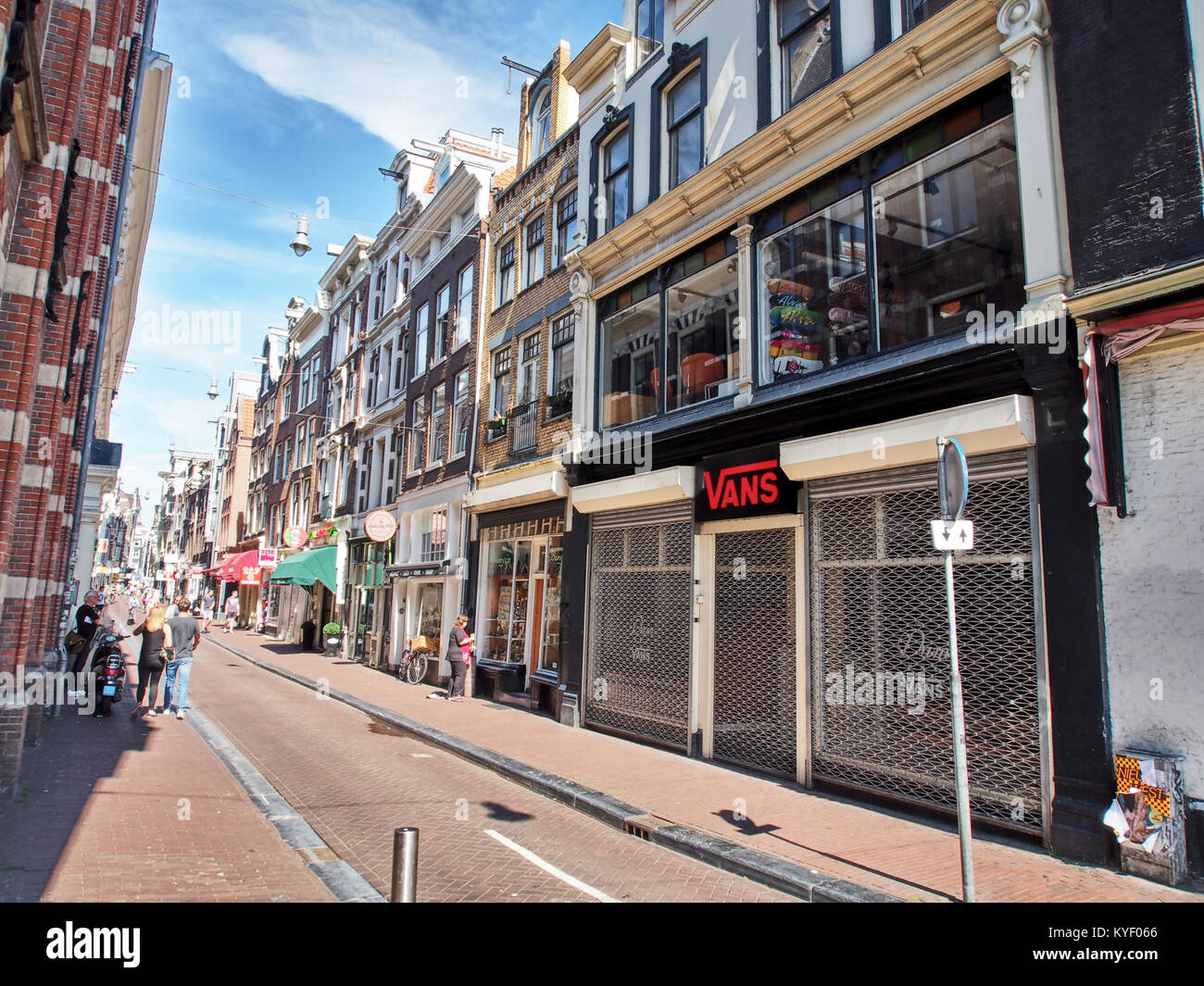 A photograph of Oude Hoogstraat in Amsterdam, showcasing the historical ...