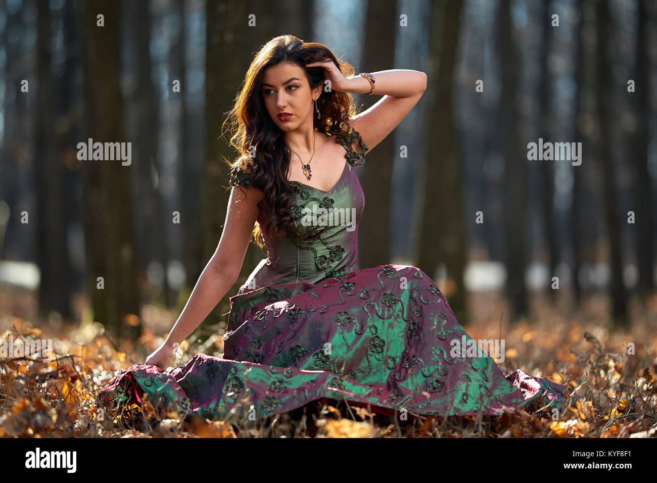 Full length portrait of a beautiful woman in green dress outdoor Stock ...