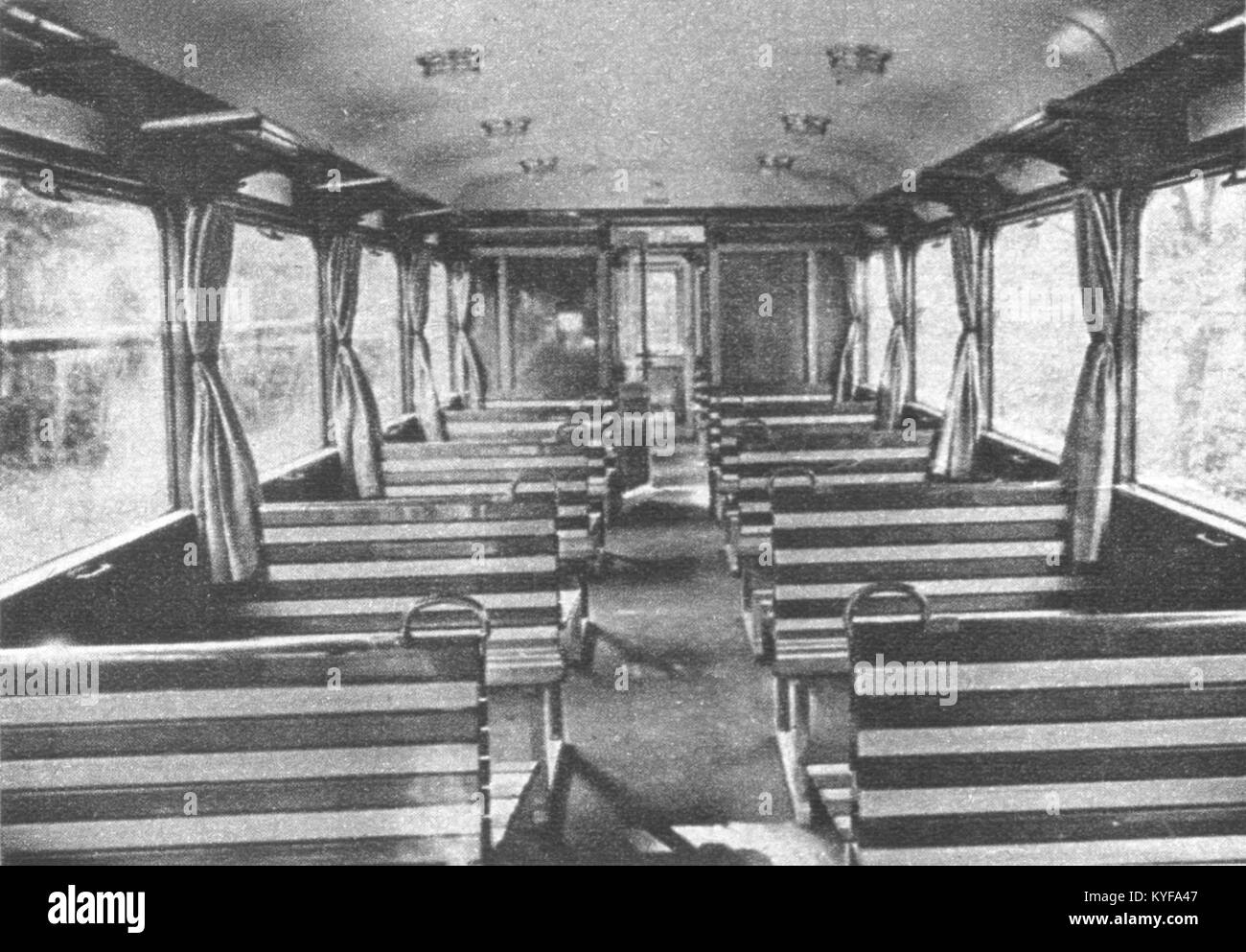 This image showcases the interior of a railway car, highlighting the ...