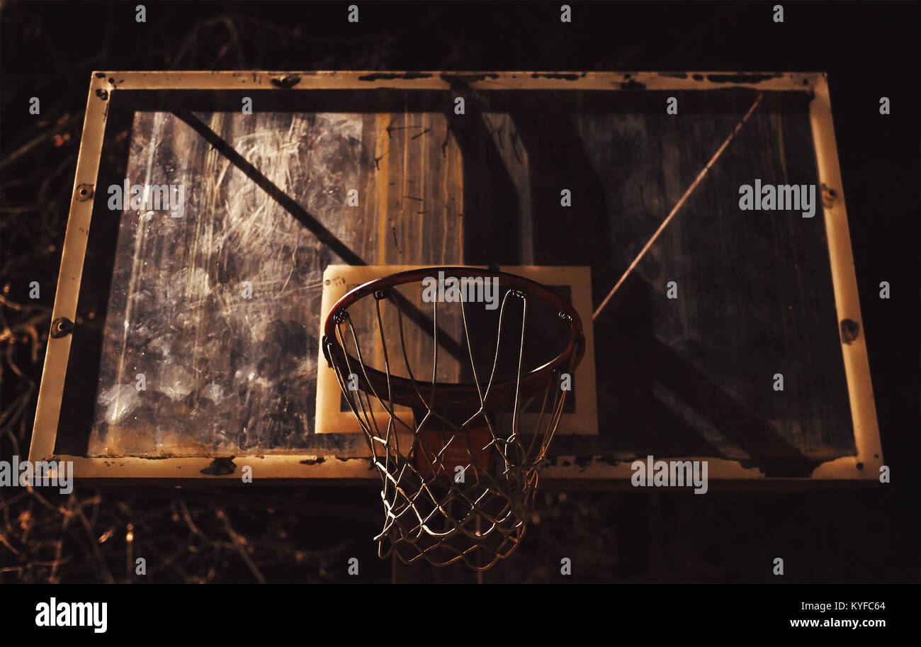 Basketball hoop in dark, illuminated by basketball yard lights Stock ...