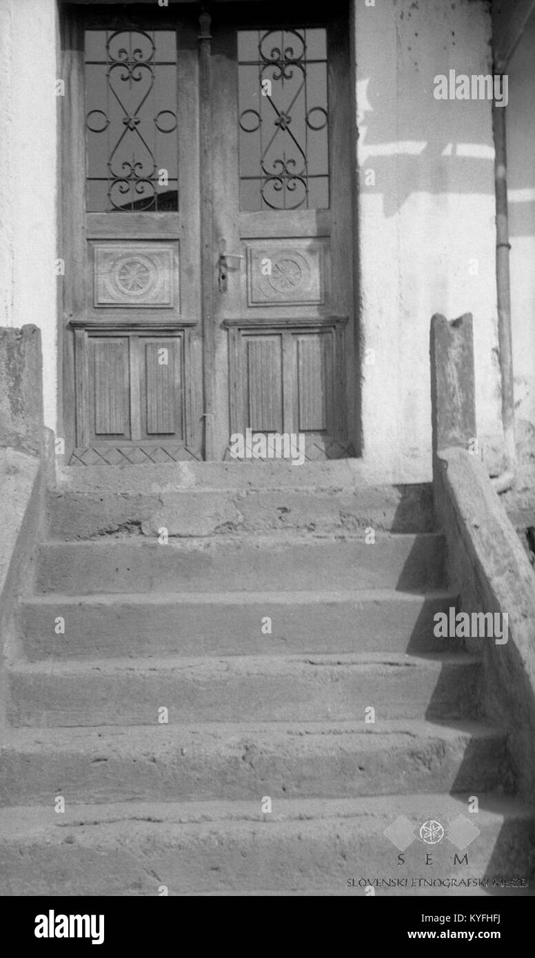 The photograph captures a historical image of the gate at house number ...