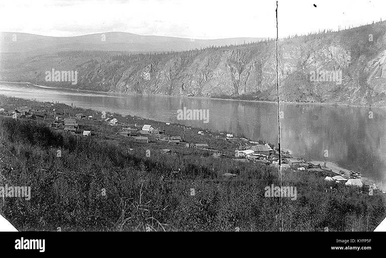 A historic photograph of West Dawson, likely along the Yukon River ...