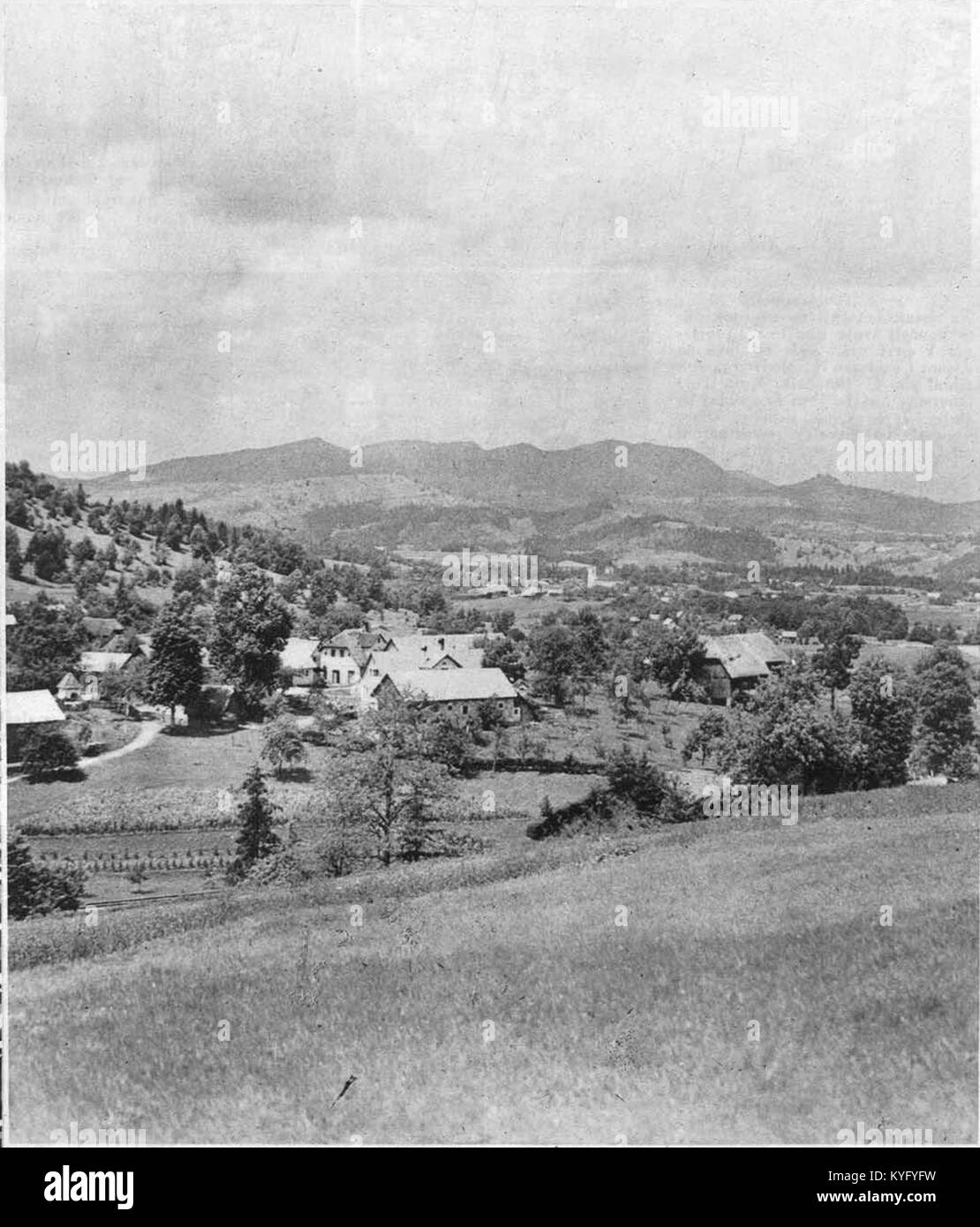 A view of Dolnje Retje with Velike Lasce in the background, depicting ...