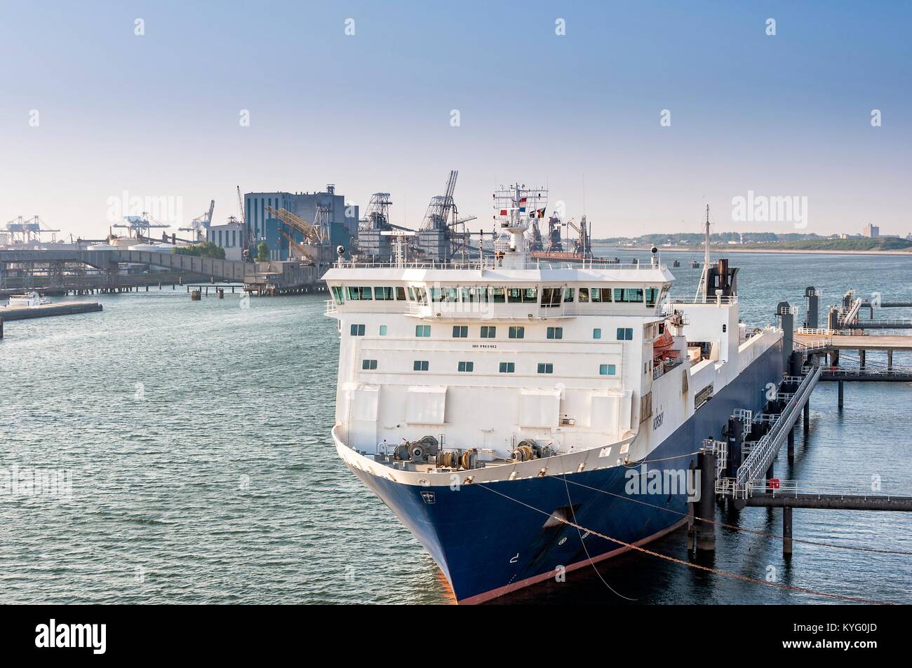 Moored ship with docks in background Stock Photo - Alamy