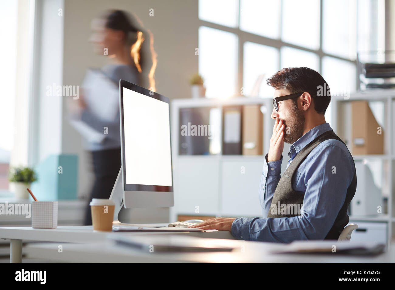 Tired at work Stock Photo - Alamy