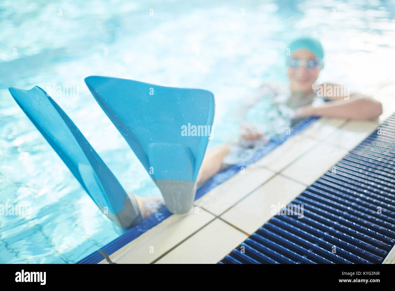 Flippers on swimmer feet Stock Photo - Alamy