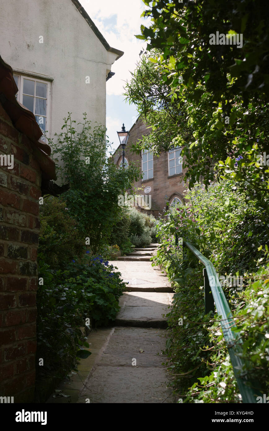 A small side street running round the back of cottages leading up to ...