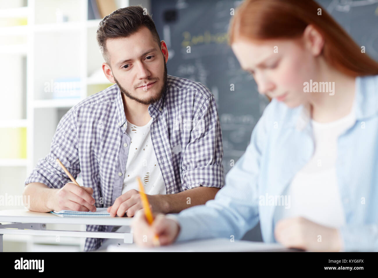 Working in classroom Stock Photo - Alamy
