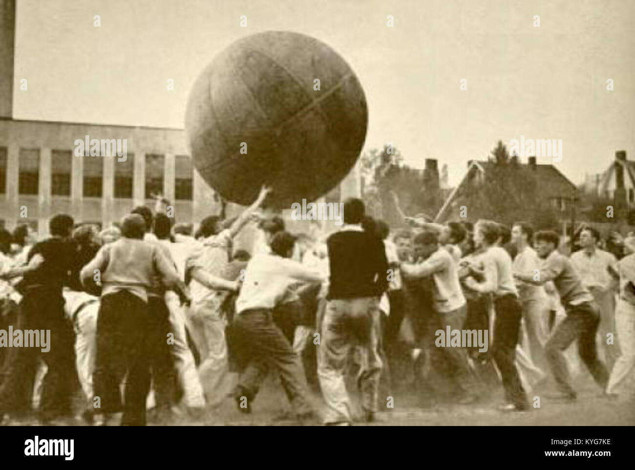 Illustration of the sport Pushball, showing two teams pushing a large ...
