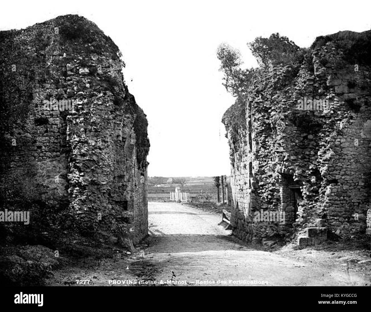 The photograph shows the defensive walls and towers of Provins, France ...