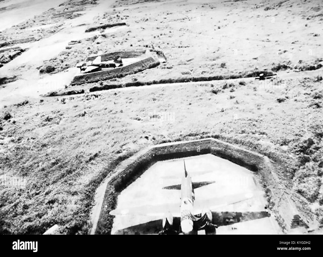 This image depicts the revetments at Vunakanau Airfield, a World War II ...