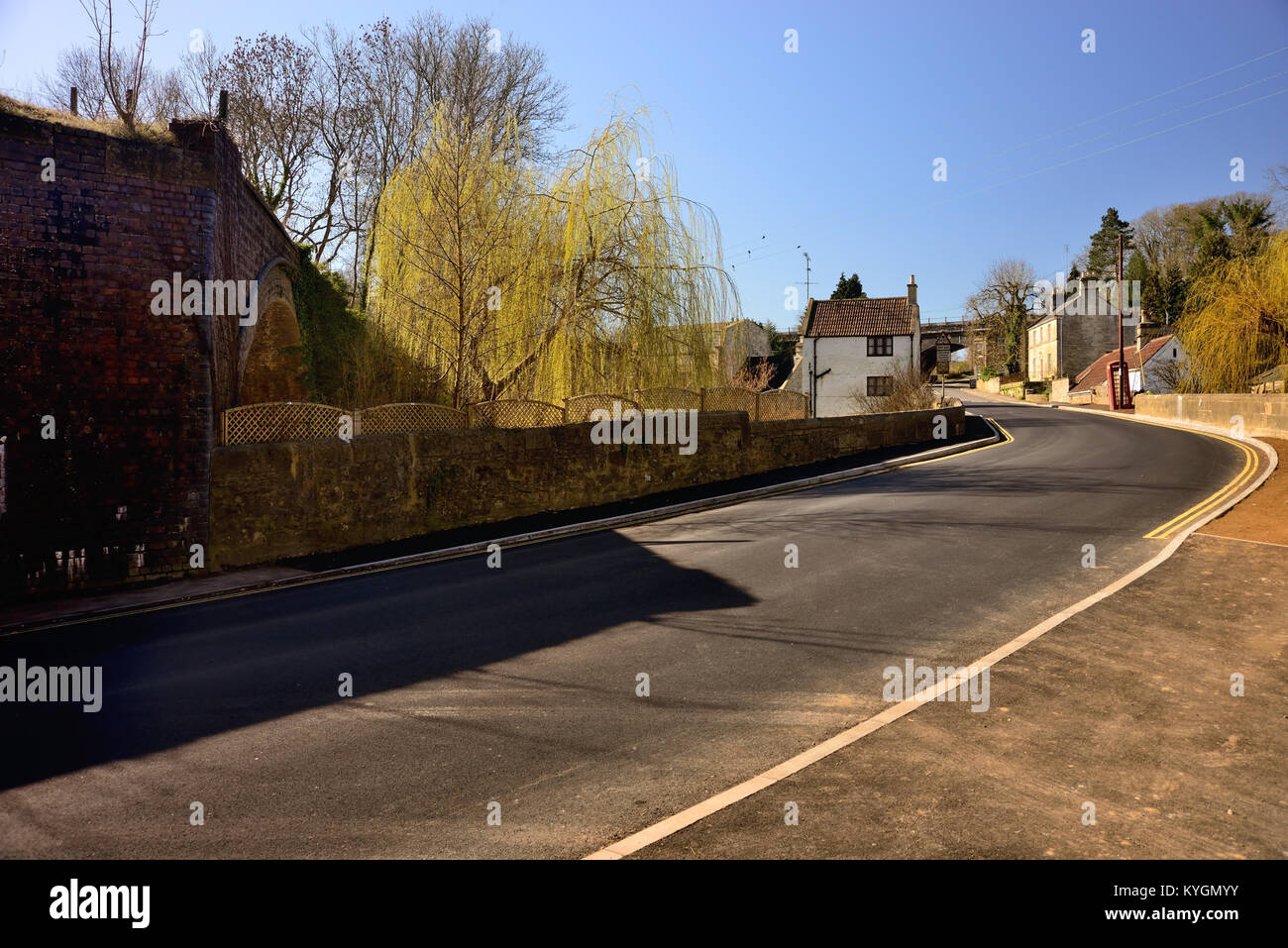 The B3110 road through Midford, seen from beside the surviving piers of ...