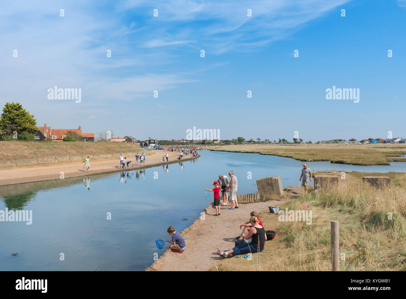 Walberswick Suffolk landscape, families fish for crabs from the edge of ...