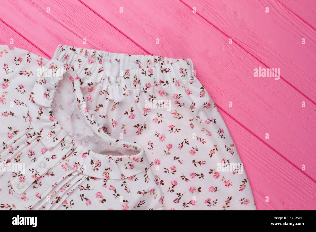 Handmade girls clothes on pink Stock Photo - Alamy
