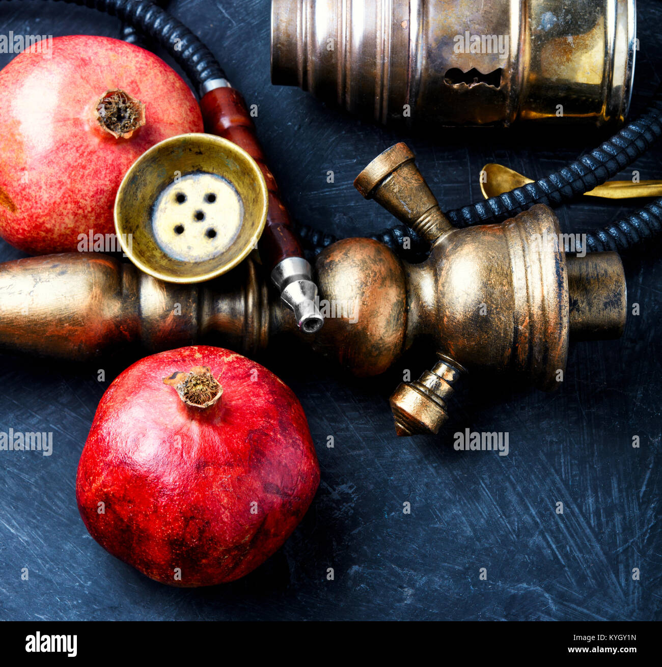 Exotic smoking shisha in east style with tobacco aroma of pomegranate ...