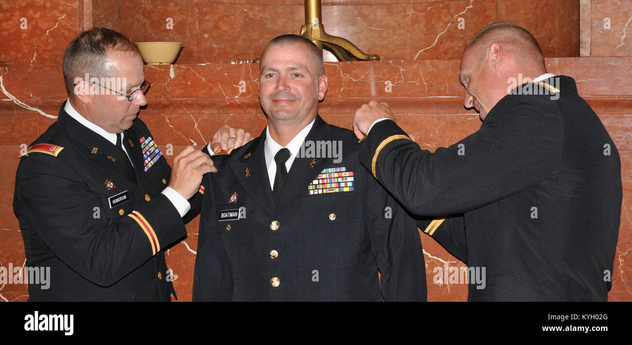 Kentucky Guardsman Robert Boatman stands at attention while being ...