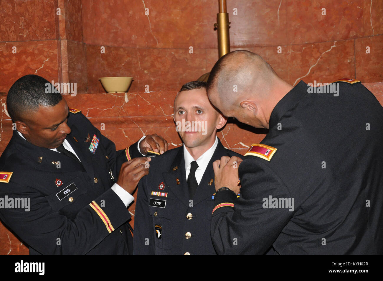Kentucky Guardsman Brandon Layne stands at attention while being pinned ...