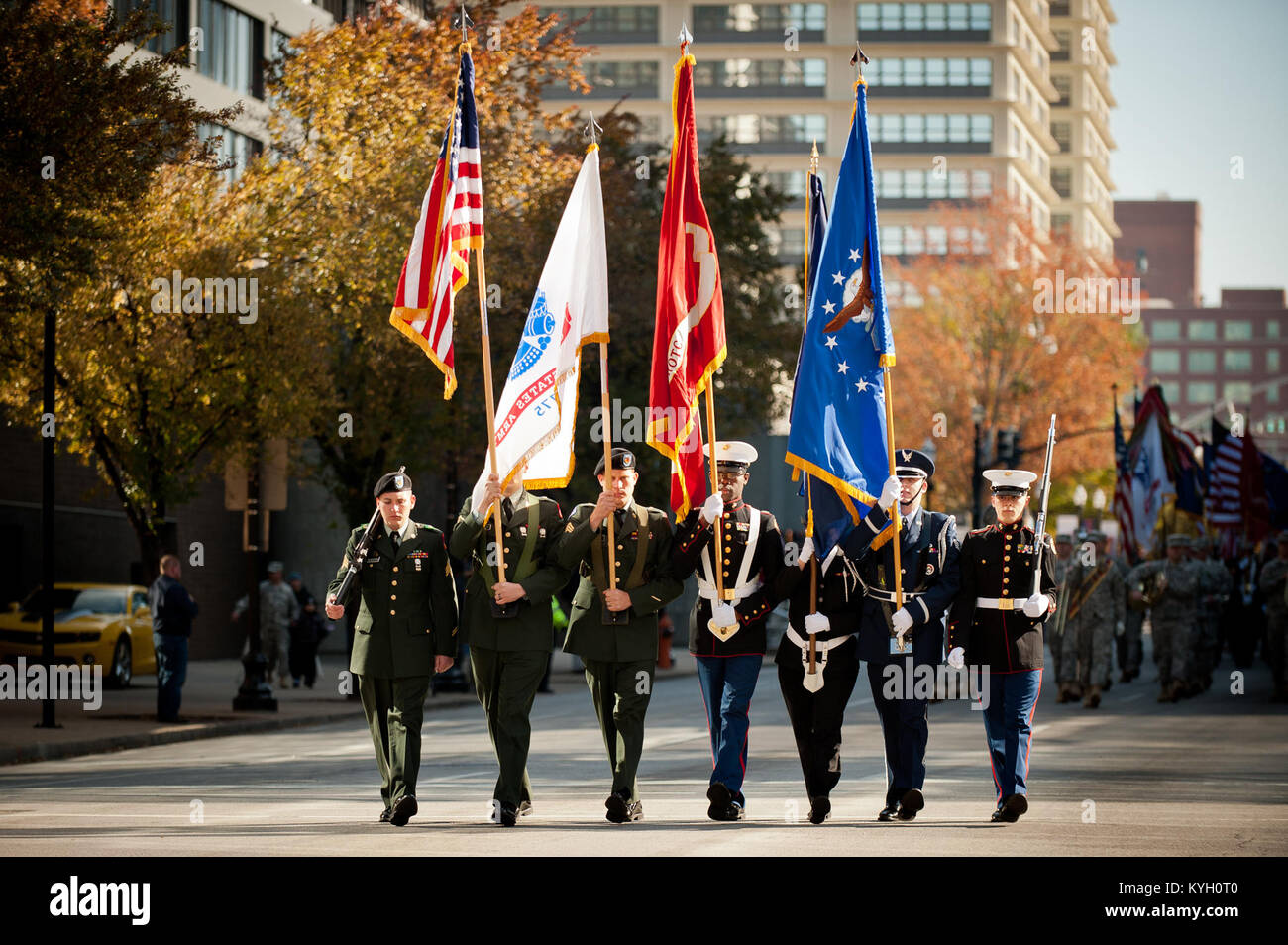 A joint color guard leads Louisville’s Veterans Day parade down Main ...