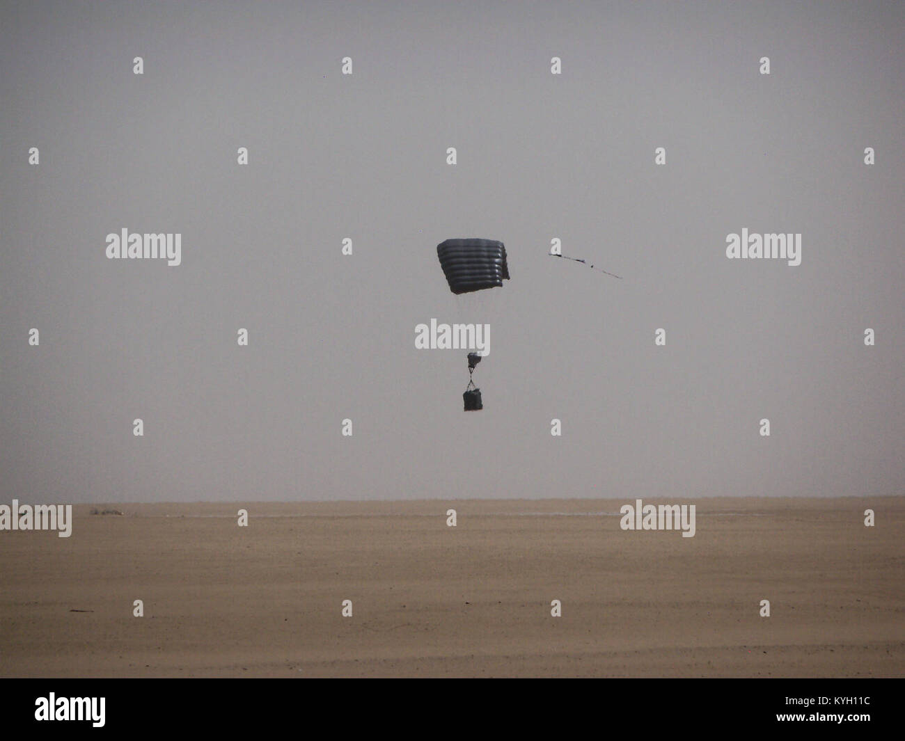 A Joint Precision Aerial Drop System (JPADS) enters a designated drop ...