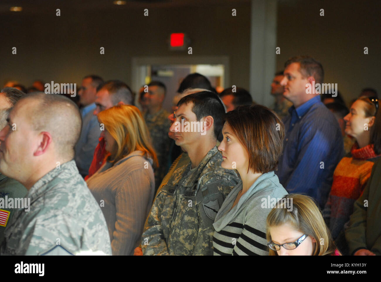 Air Guardsman Tech. Sgt. Bucky Harris and his wife Shaina stand to be ...
