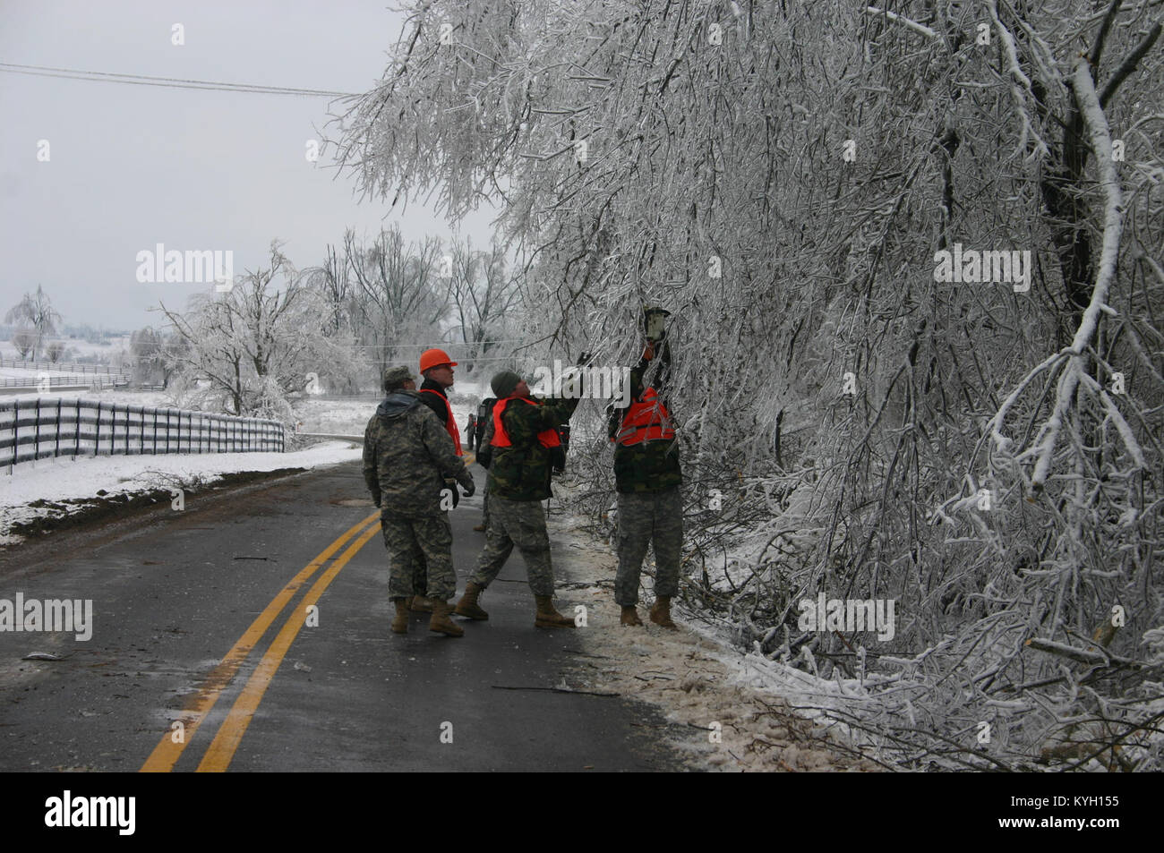 Soldiers from A Co. 103rd Brigade Support Battalion cut down trees ...