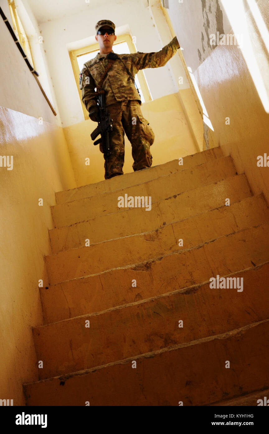Spc. Joseph Bucaro of Louisville, Ky. stops atop a flight of stairs ...