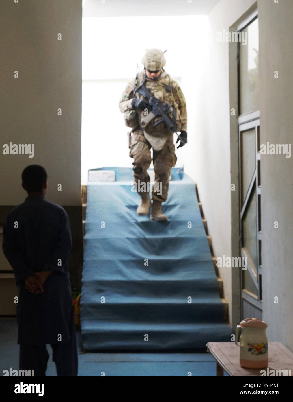 Staff Sgt. Robert Foushee of Lexington, Ky. descends a flight of stairs ...