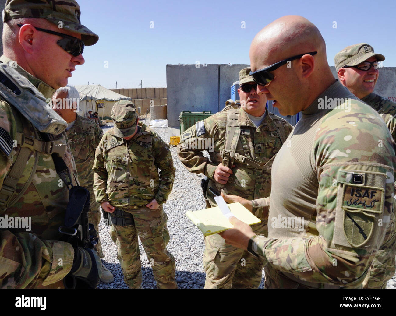 Staff Sgt. Robert Foushee (right) of Lexington, Ky. goes over notes ...