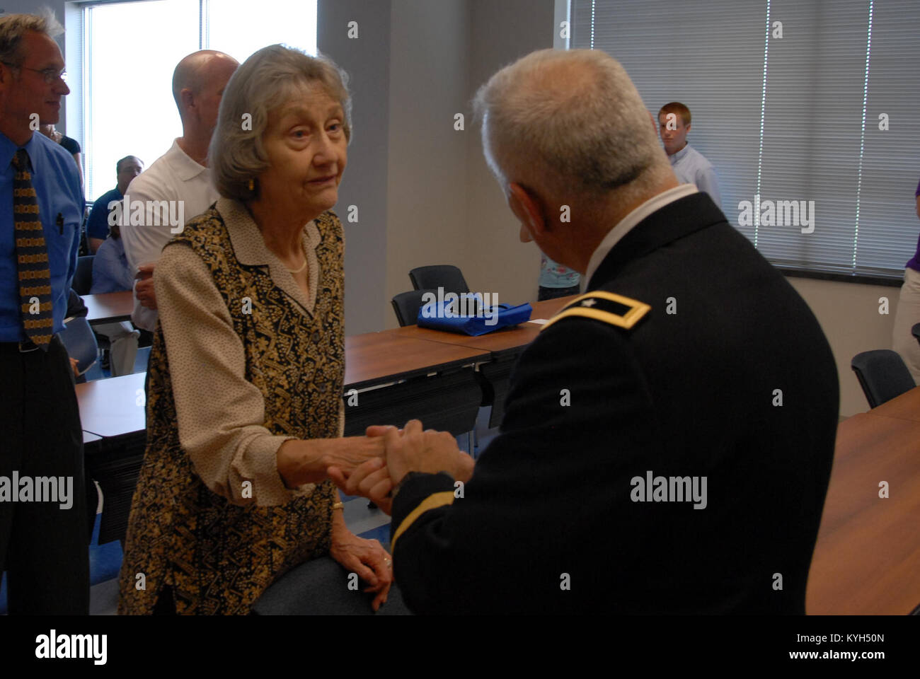 Mrs. Whitten is greeted by BG (CH) Patrick Dolan before a ceremony ...