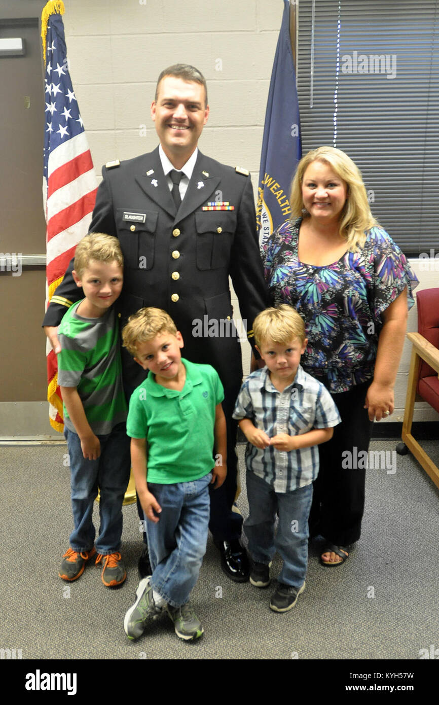Capt. Mark Slaughter and his family following his promotion ceremony at ...