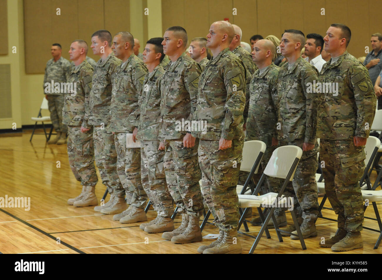 Soldiers of the 613th Engineer Facilities Detachment stand at attention ...