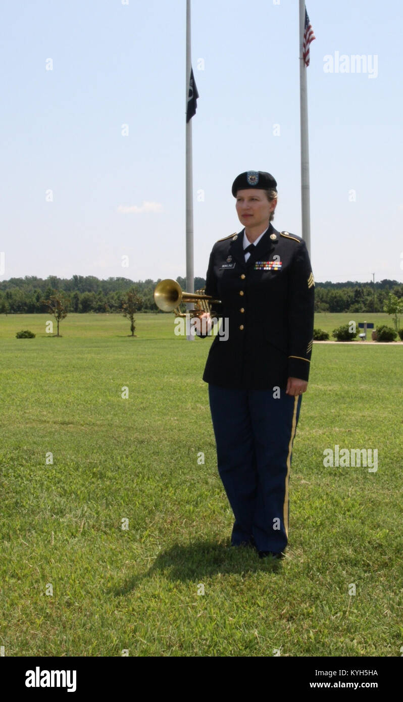Sgt. Jennifer Bowling prepares to play Taps during a ceremony in Fort ...