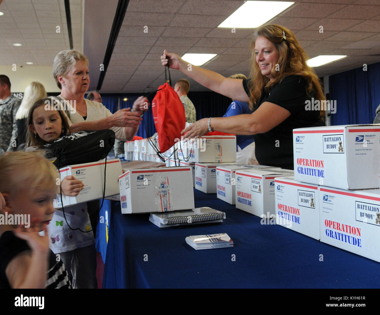 Workers with the Kentucky National Guard's Yellow Ribbon Program pass ...