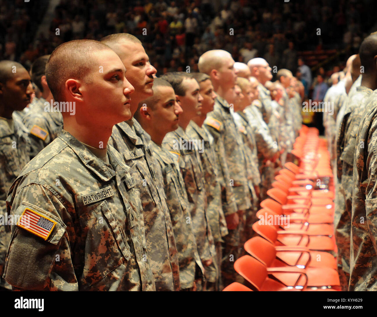 Soldiers of the 2nd Battalion, 138th Field Artillery stand at attention ...