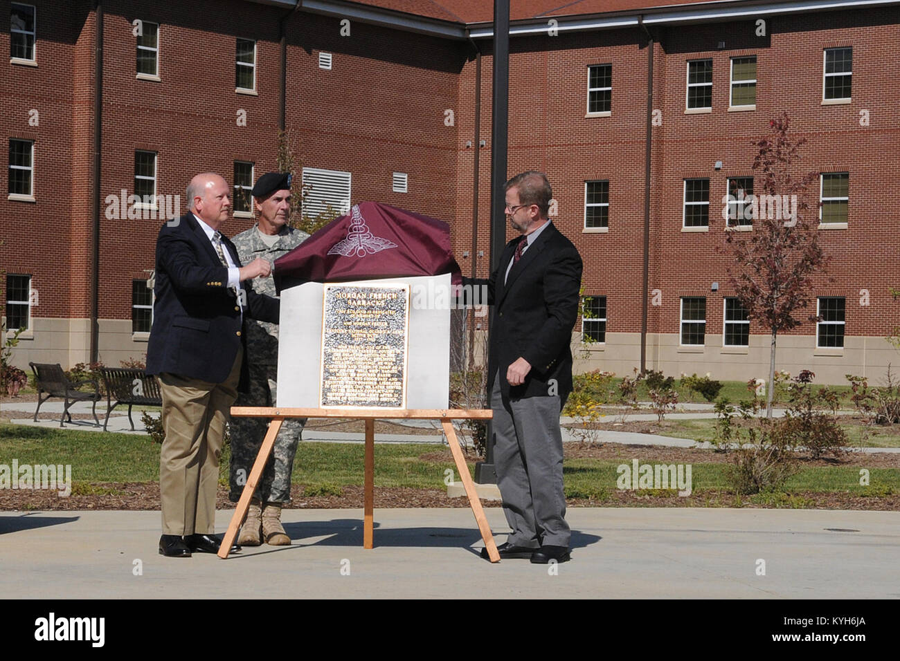 Family members of Master Sgt. Morgan French unveil a plaque during a ...