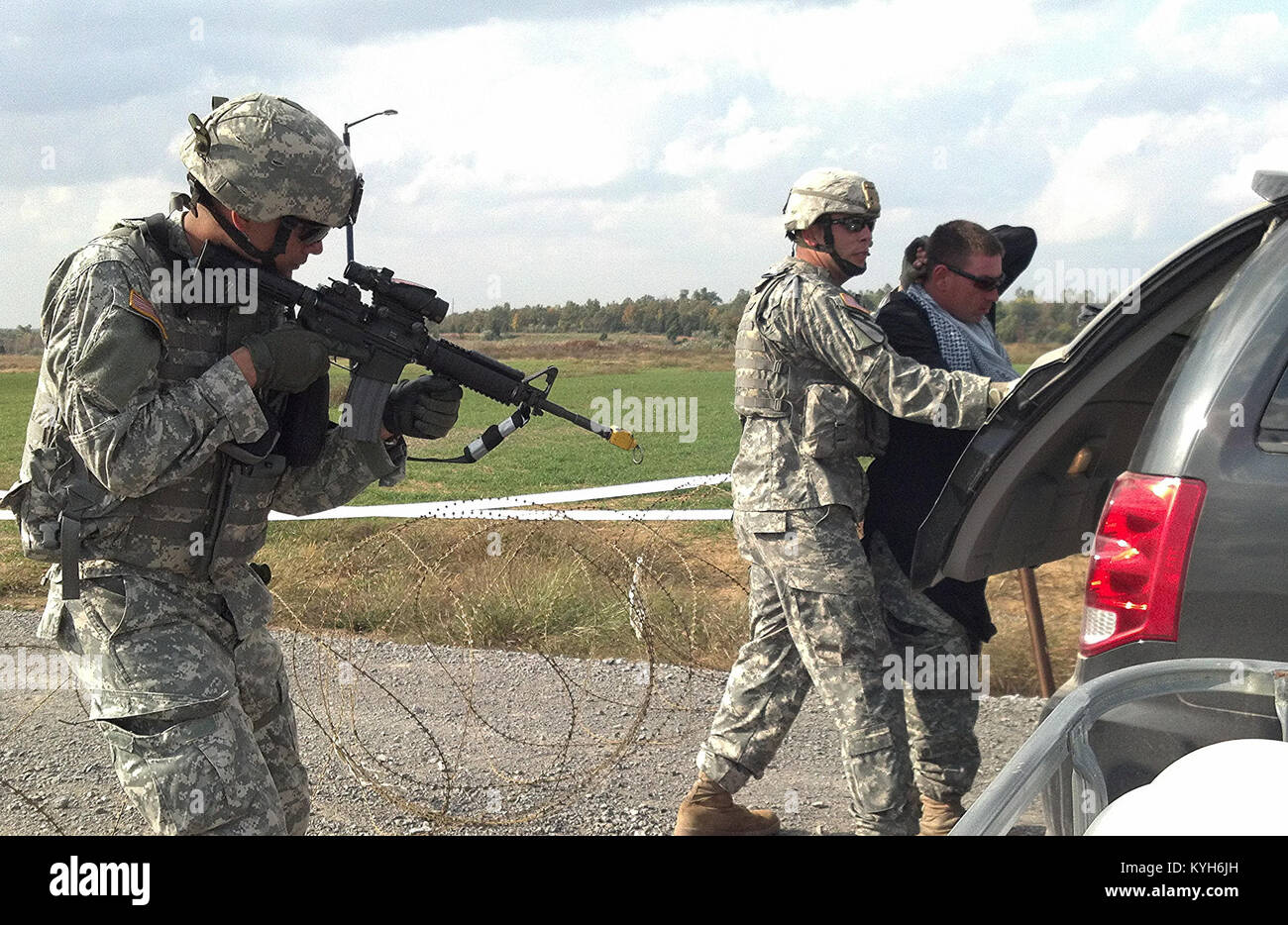 Staff Sergeants Matthew Nicholson and Landon Driver work through a ...